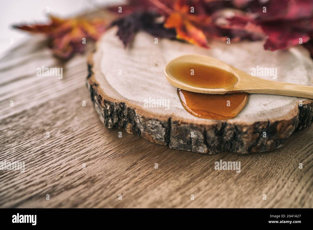 Maple syrup sugar liquid in wooden spoon from Quebec restaurant sugar ...