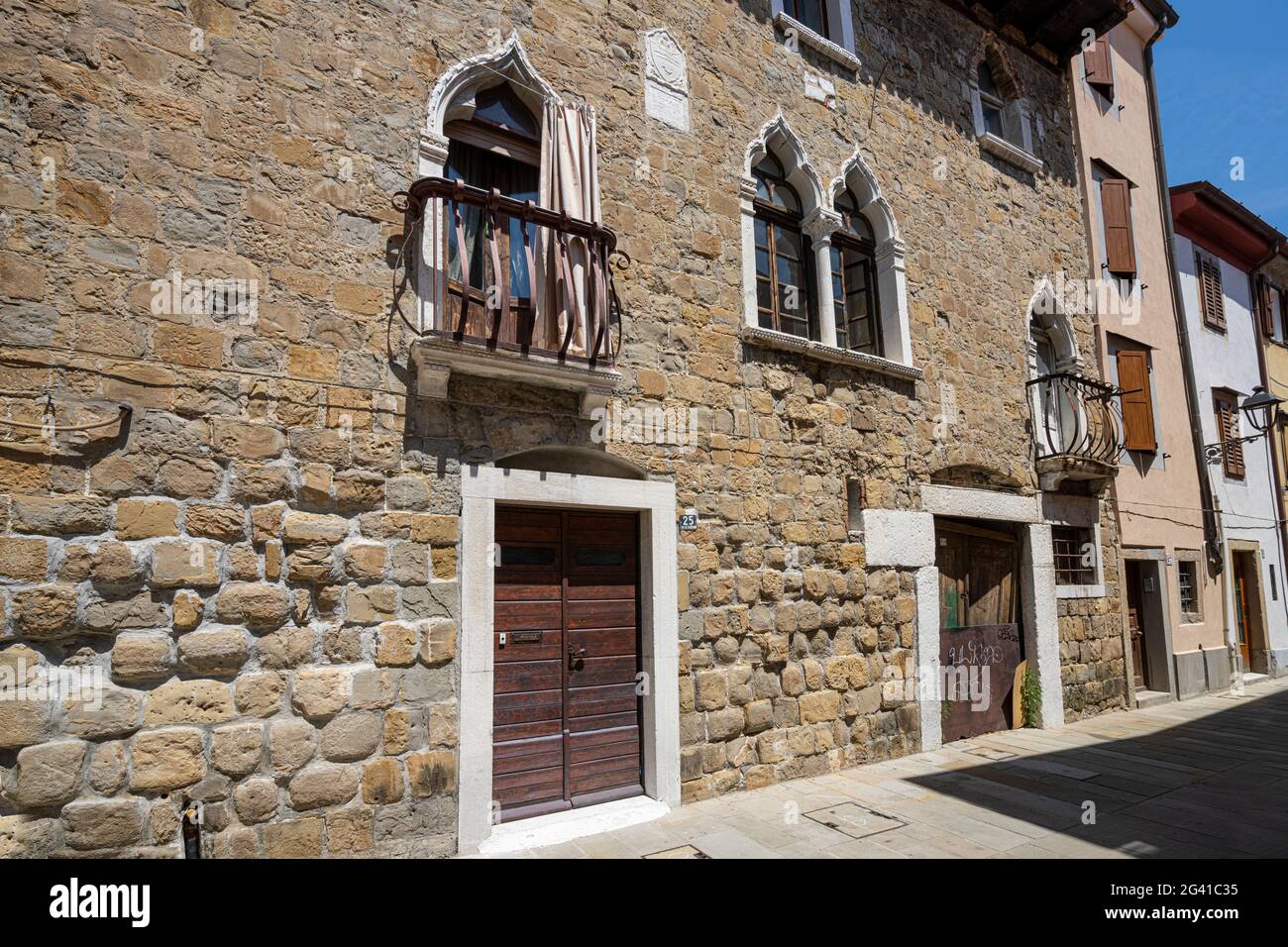 Muggia, Italy. June 13, 2021. An ancient house in the historic center ...