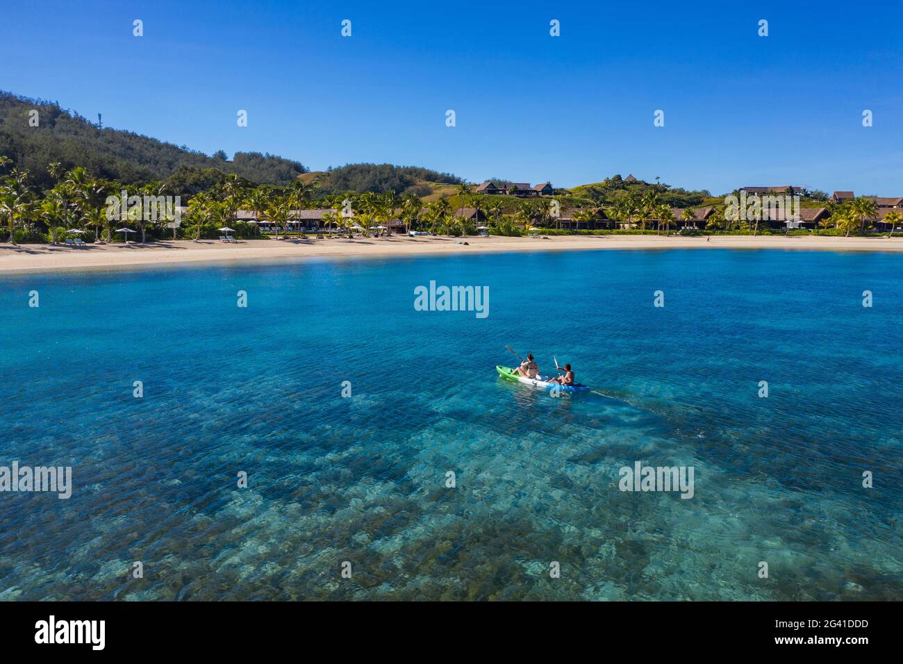 Aerial view of couple in kayak at Six Senses Fiji Resort, Malolo Island ...