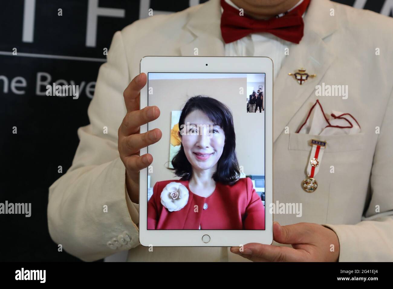 Los Angeles, California, USA. 17th June, 2021. TV host Joey Zhou holds ...