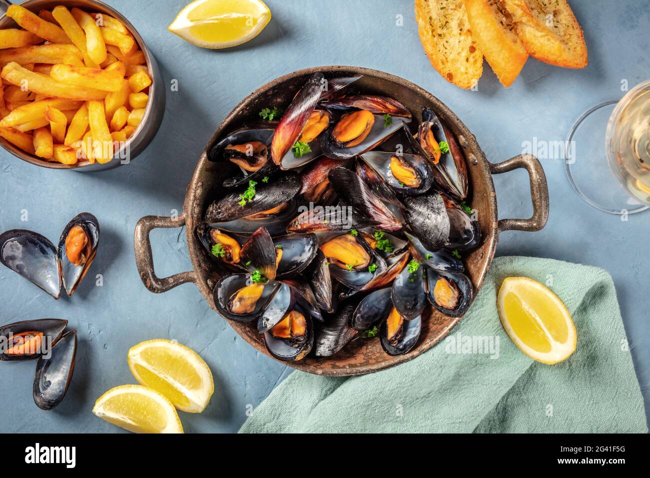 Mussels, overhead flat lay shot on a blue background Stock Photo - Alamy