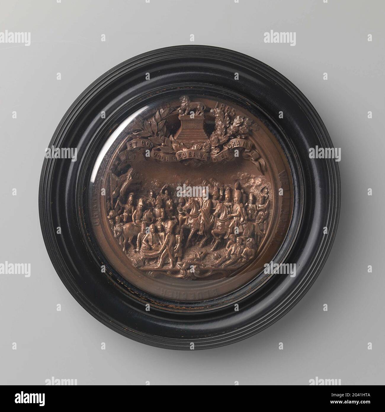 Battle of Waterloo. Round plaque of bronze caught in dark wooden table ...