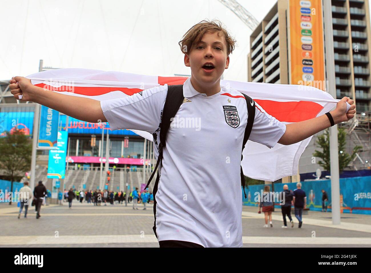 London, UK. 18th June, 2021. An England fan shows off his flag outside ...