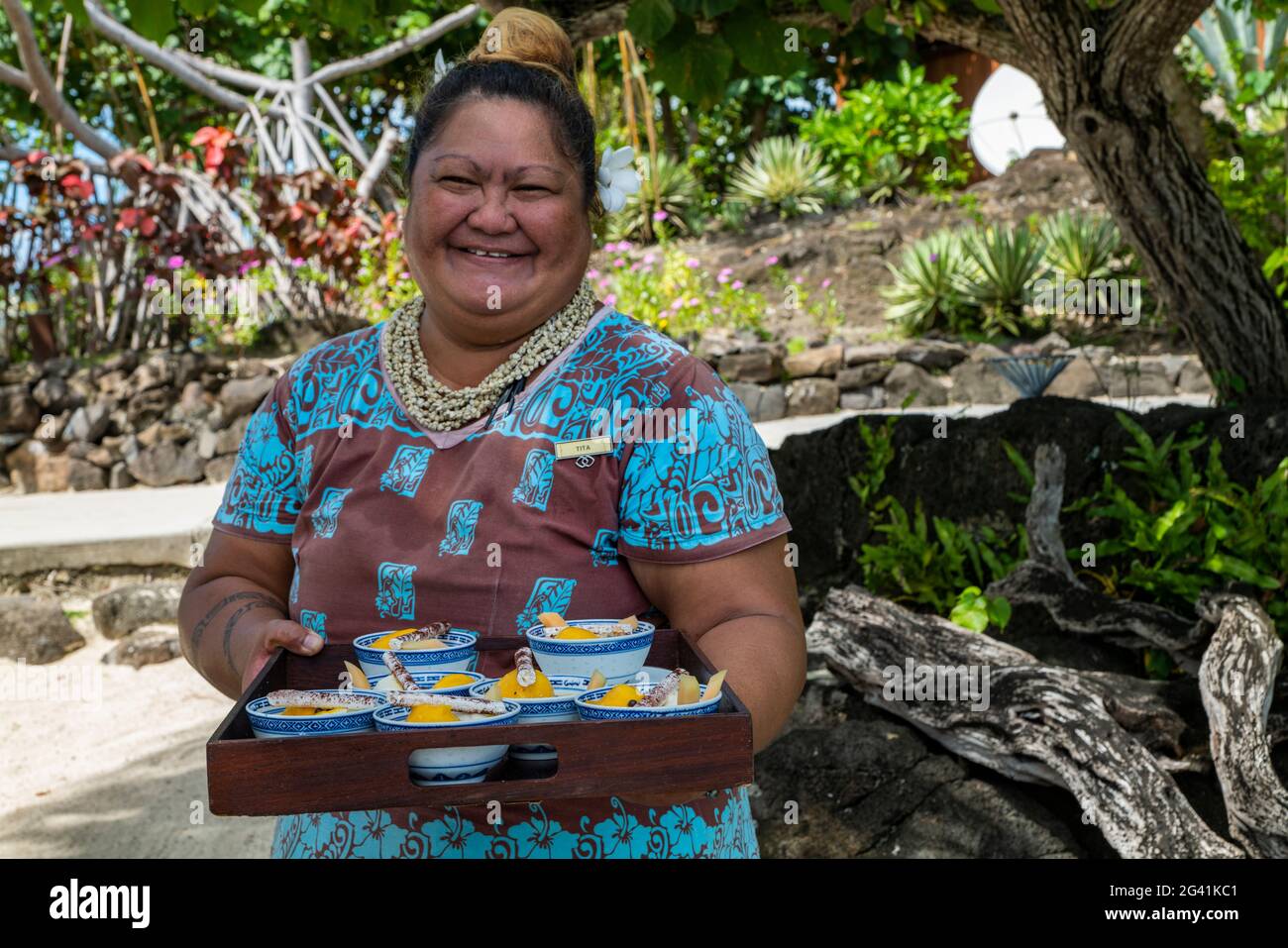 Friendly waitress with tray of ice cream at Sofitel Bora Bora Private ...