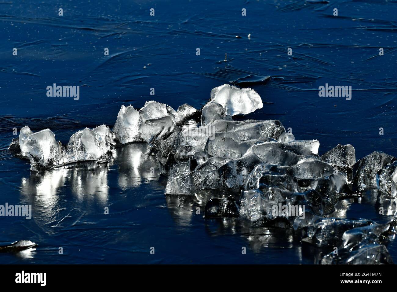 Unusual ice formation in the morning light on a lake, Grimsholmen ...