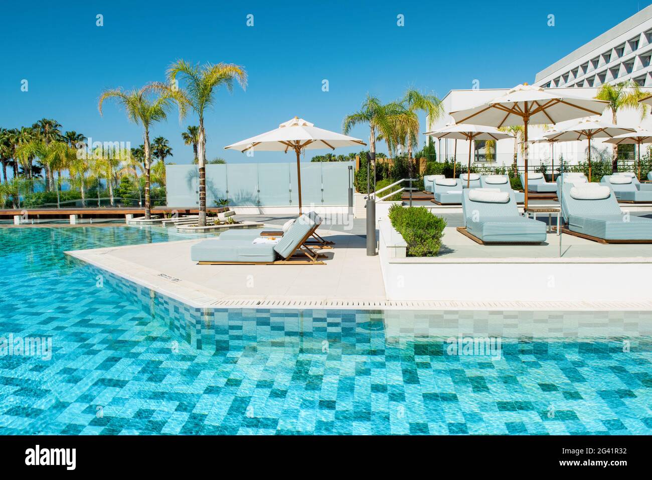 Limassol, Cyprus - May 19, 2021: Pool area in luxury hotel with sunbeds ...