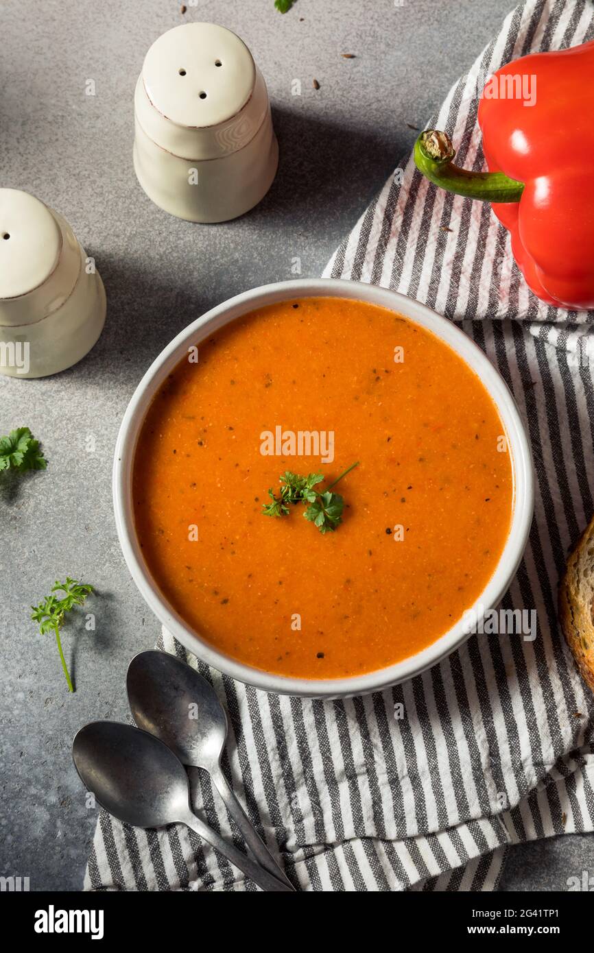 Healthy Homemade Red Bell Pepper Soup with Bread Stock Photo - Alamy