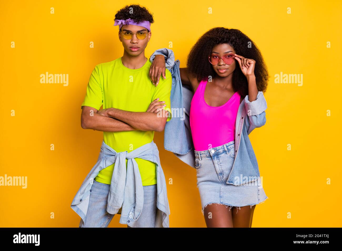 Portrait of attractive serious cool funky couple posing wearing denim ...