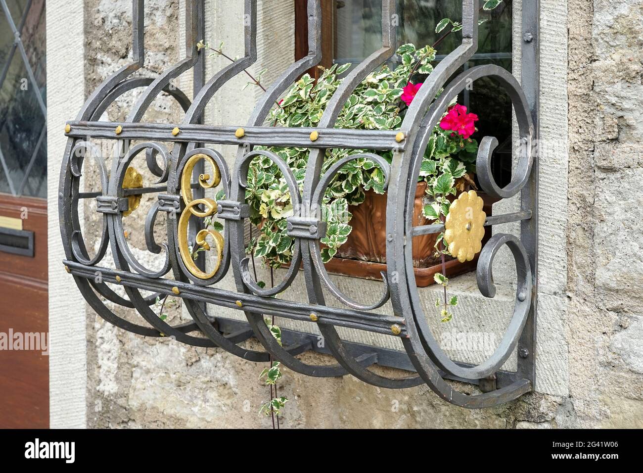 Security bars over a window in Rothenburg Stock Photo - Alamy