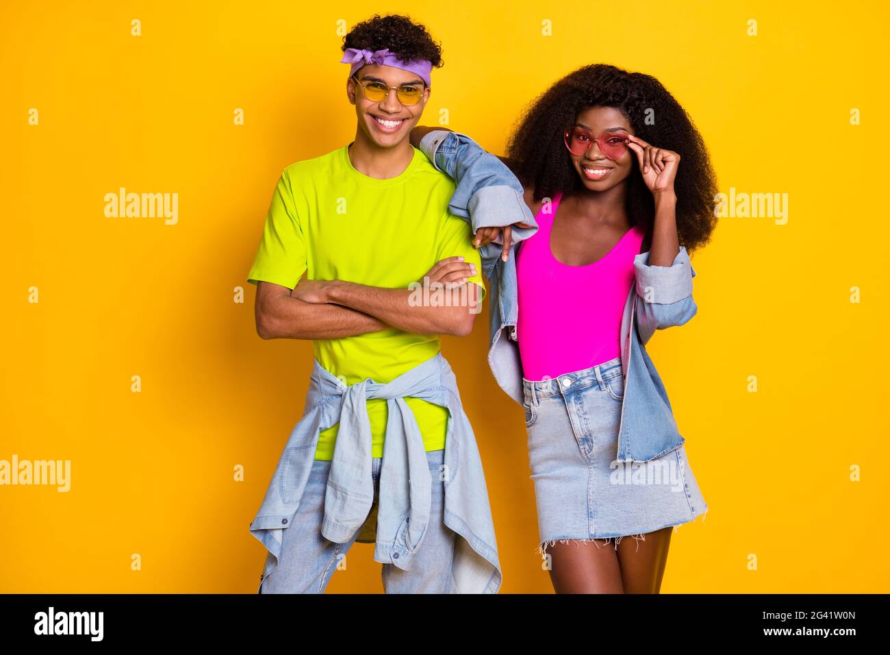 Portrait of attractive cheerful cool funky couple posing wearing denim ...