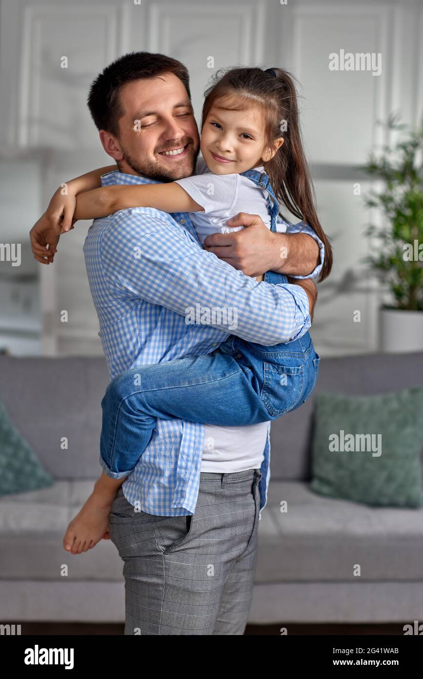 smiling father hugging his cute little child daughter Stock Photo - Alamy
