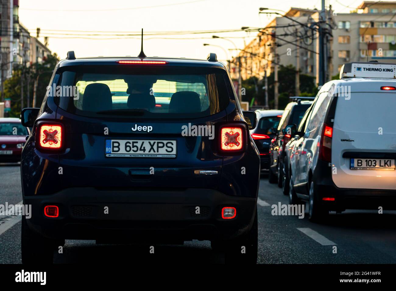 Car traffic at rush hour. Traffic jam, cars on the road at sunset in ...