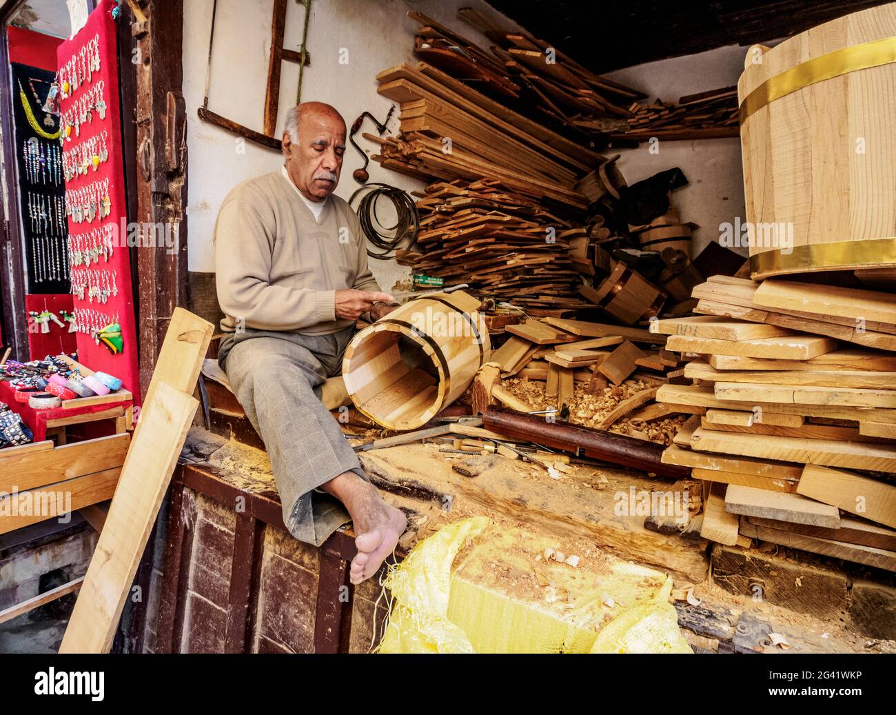 Cooper in his workshop inside the Old Medina of Fes, Fez-Meknes Region ...