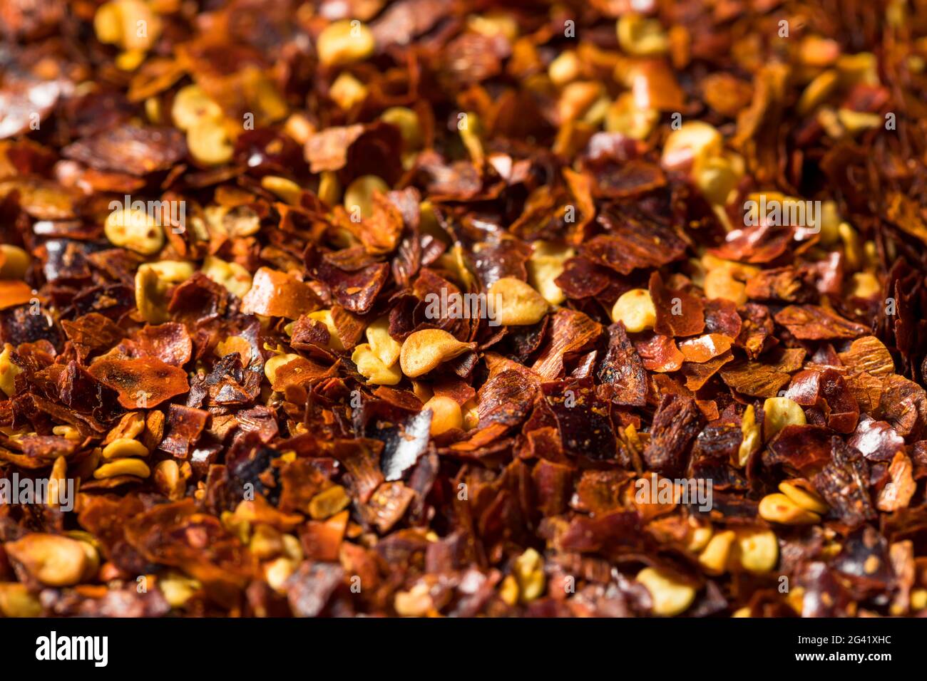 Organic Raw Red Pepper Flakes in a Bowl Stock Photo - Alamy