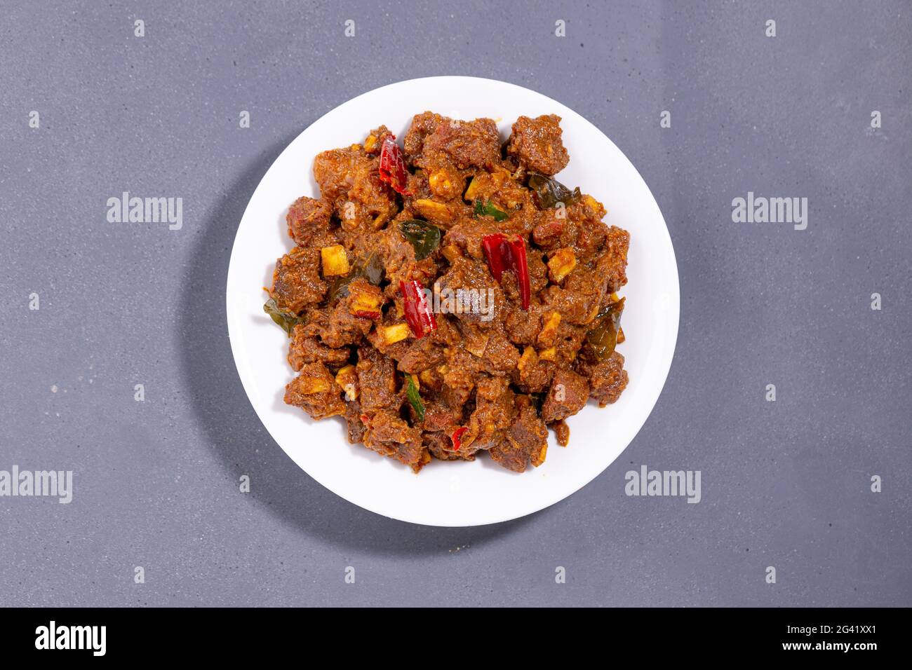 Beef roast or pothu ulartheyadu, kerala special dish arranged in awhite ...