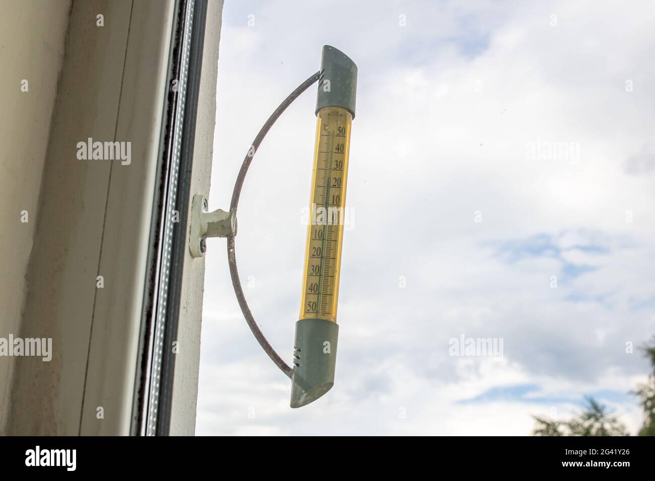 Outdoor thermometer on the window close up on sky background Stock ...