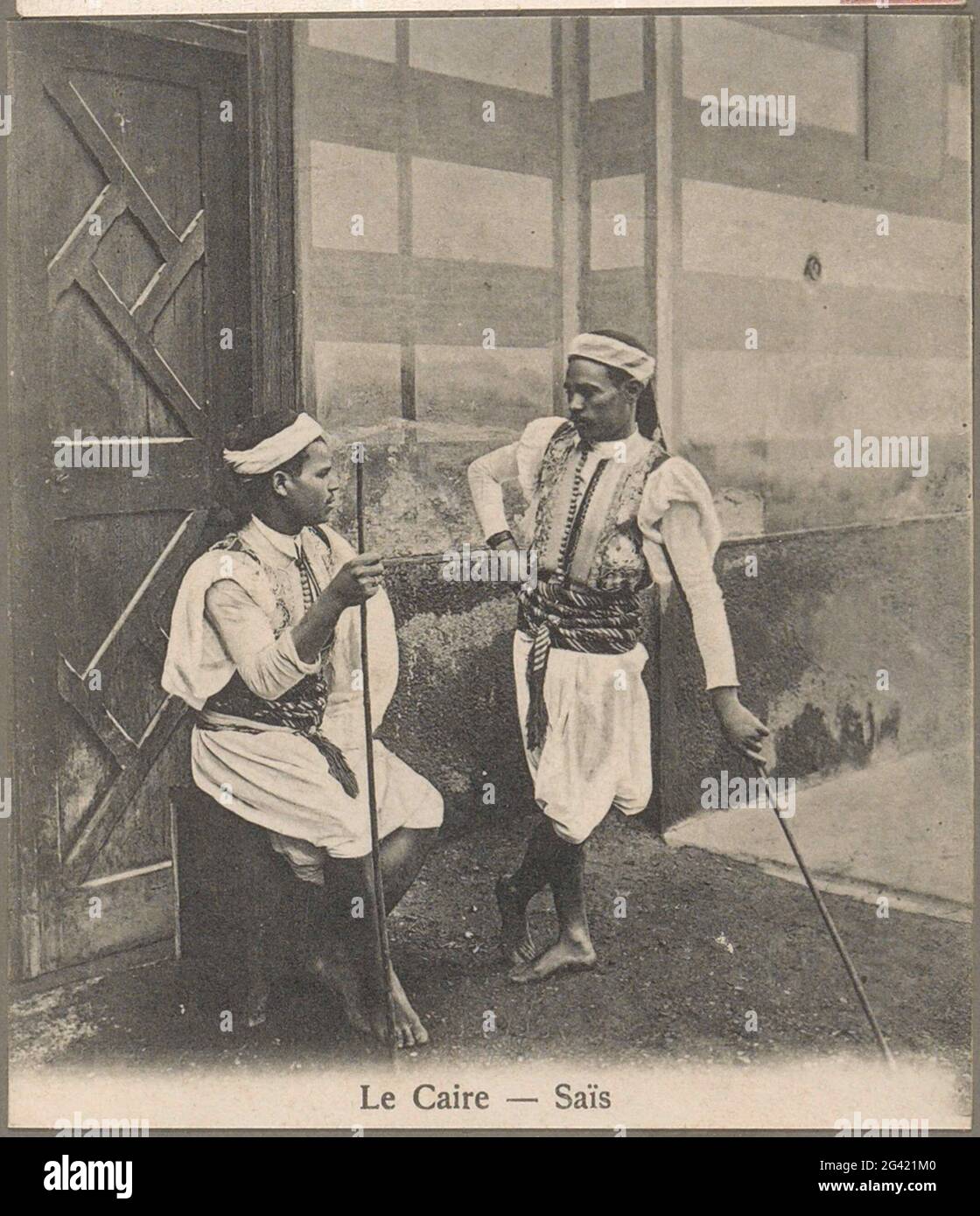 Men referred to as 'saïs' on the street in Cairo; Le Caire - Saïs. Part of travel album with ...