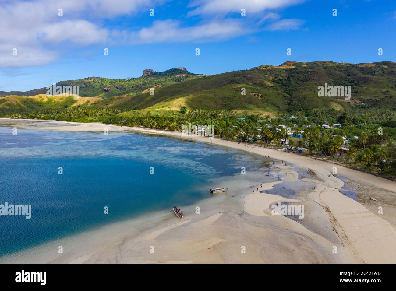 Aerial view of beach at low tide with village behind, Gunu, Naviti ...