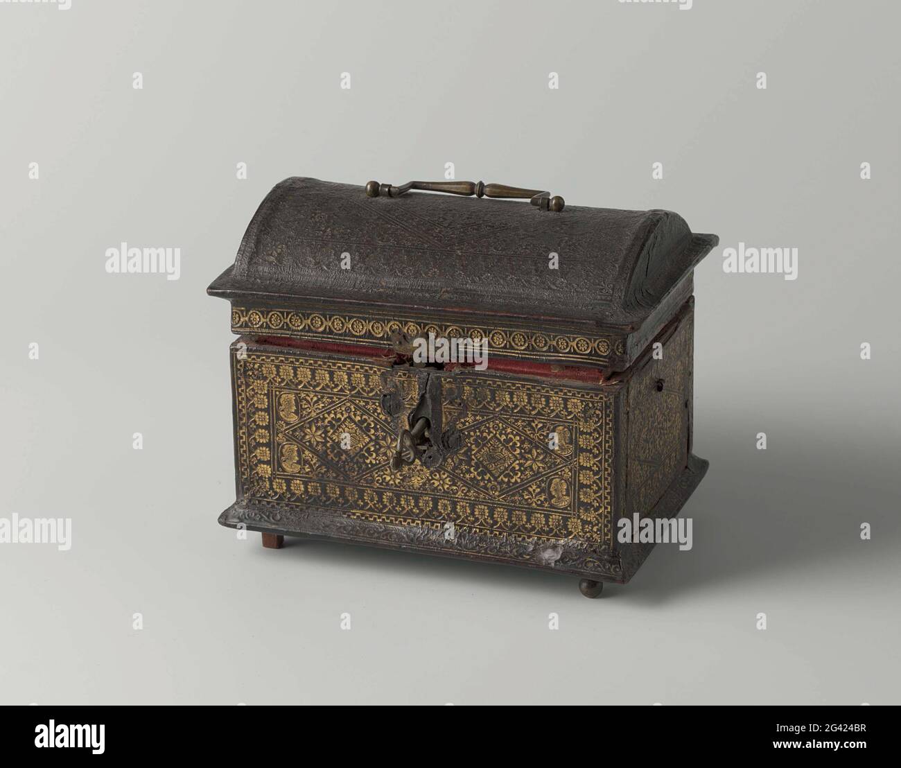 Coffin with key, lined with leather, golden painted Stock Photo - Alamy