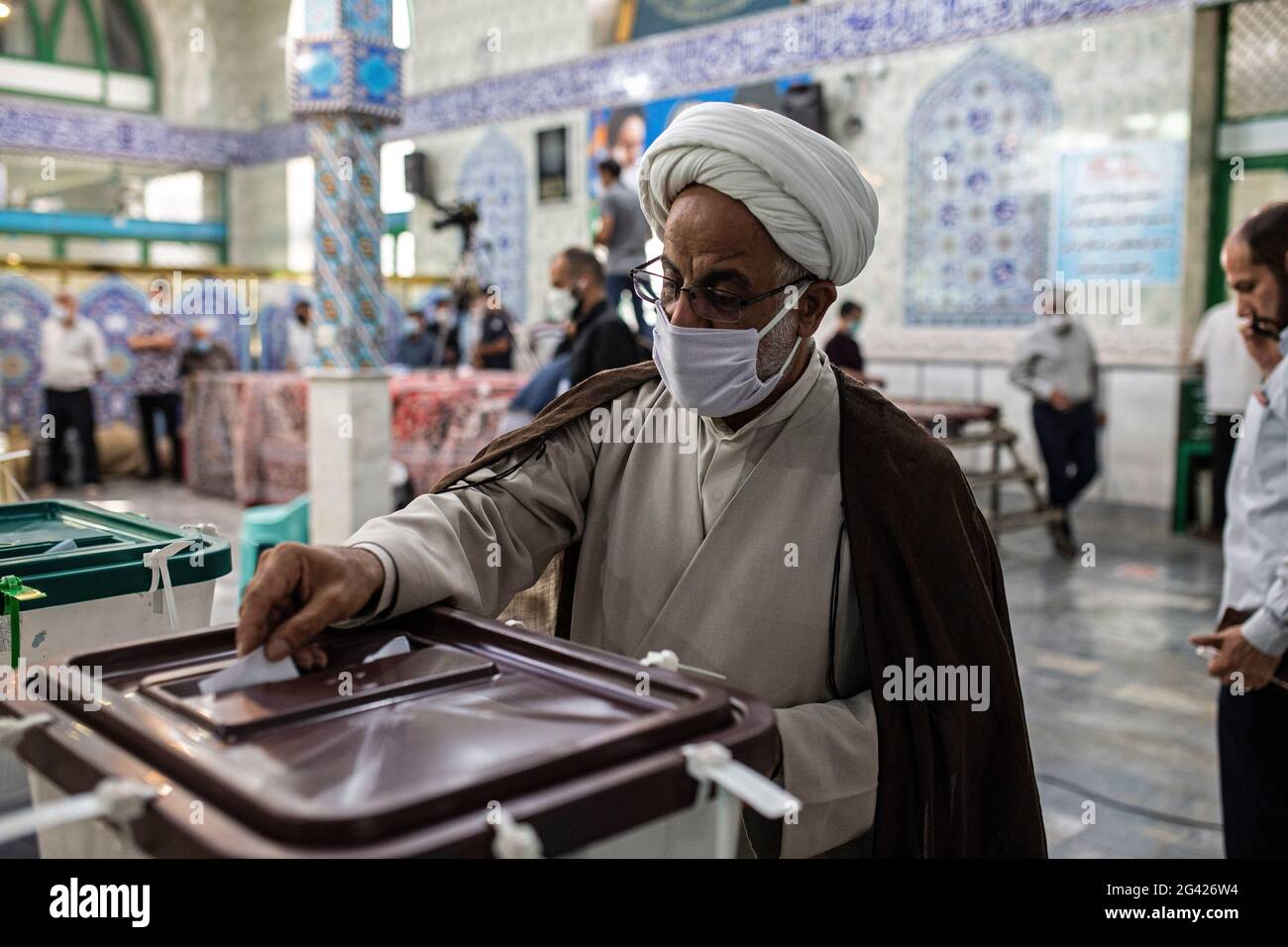 Tehran, Iran. 18th June, 2021. A voter casts his ballot at a polling ...