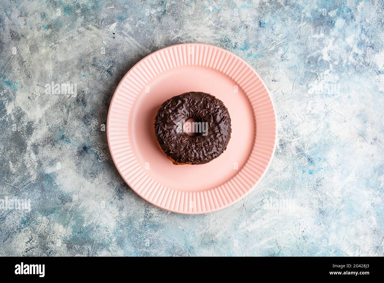 Chocolate Donut on Pink Plate. View from Above Stock Photo - Alamy