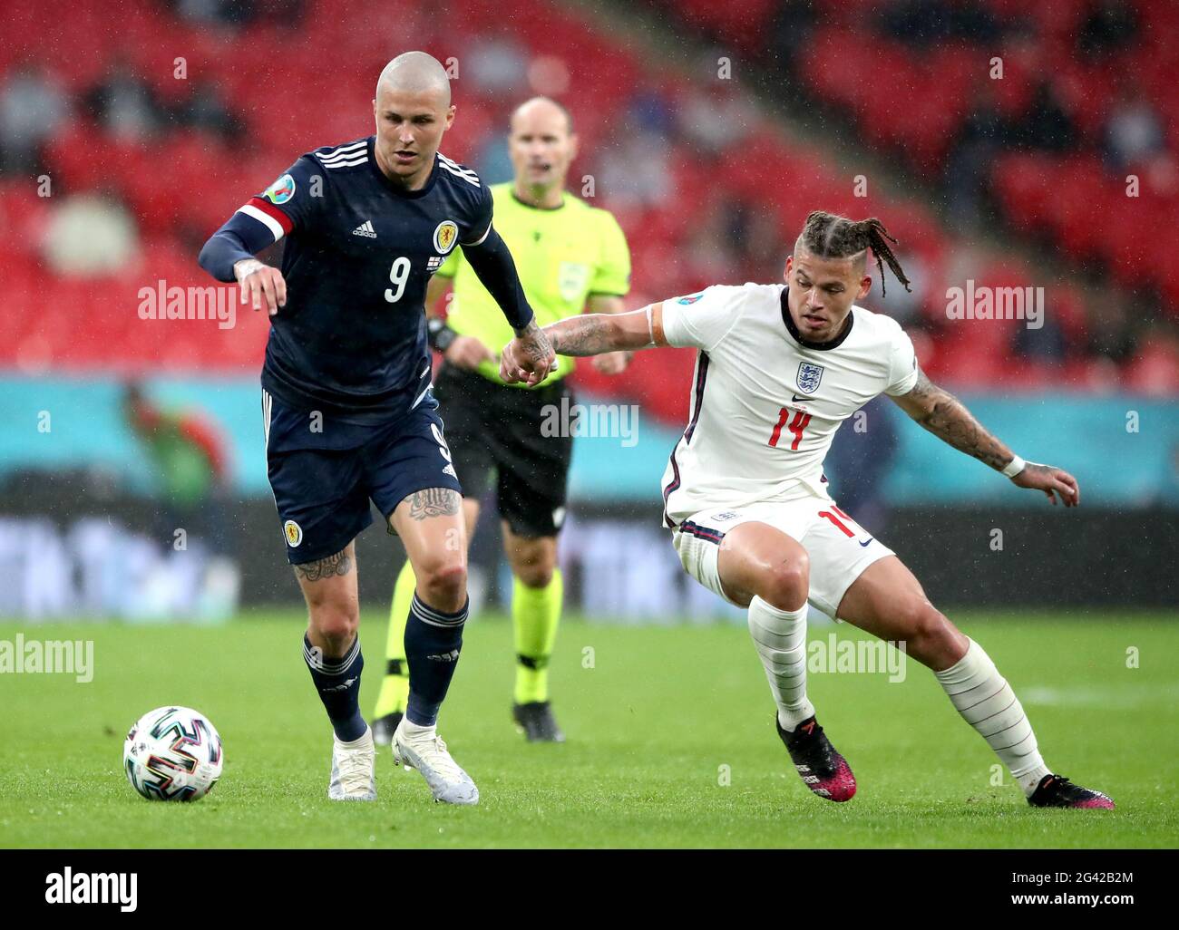 Scotland's Lyndon Dykes (left) and England's Kalvin Phillips battle for ...