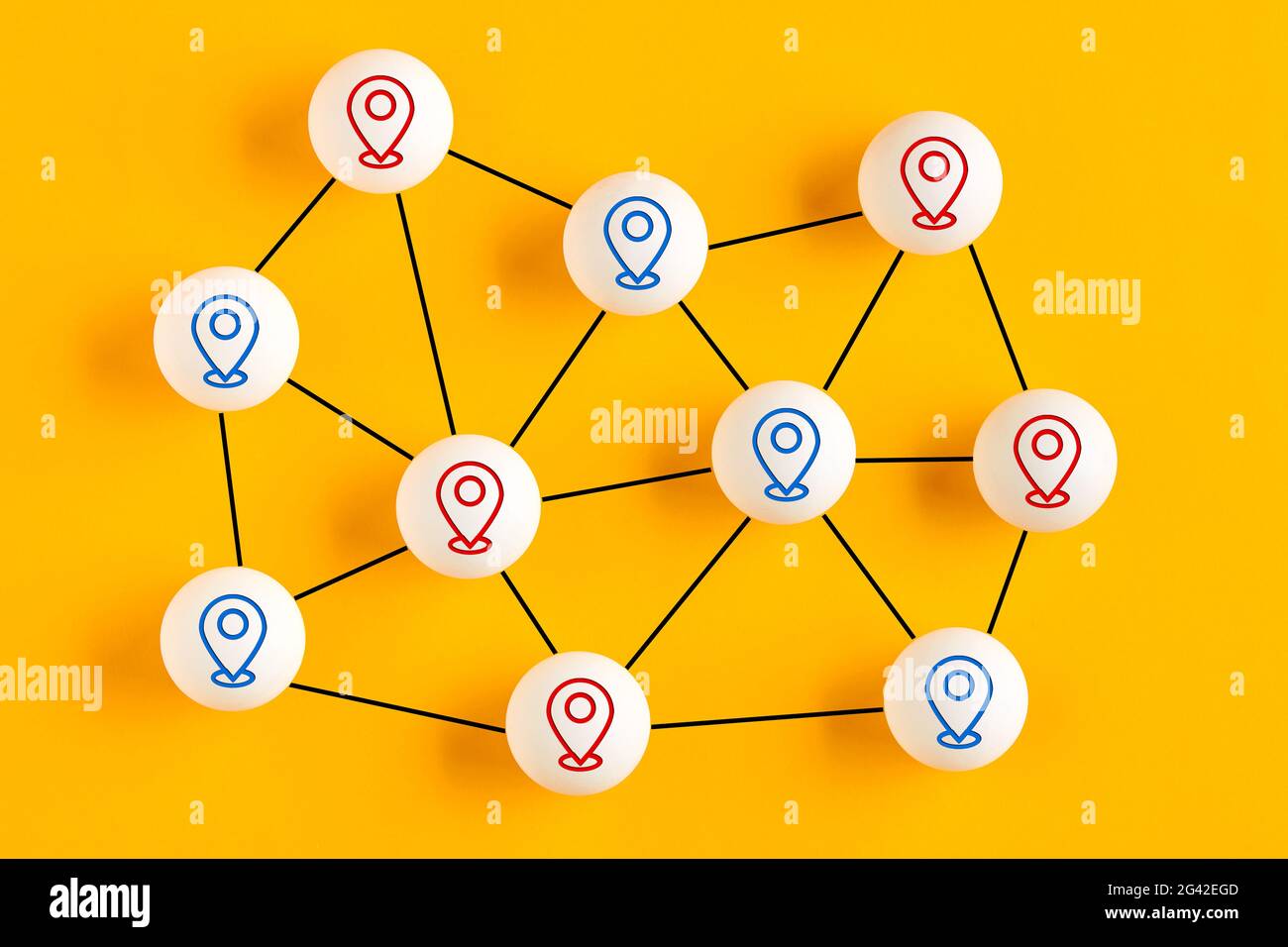 Balls with location pin map icons linked to each other representing a ...