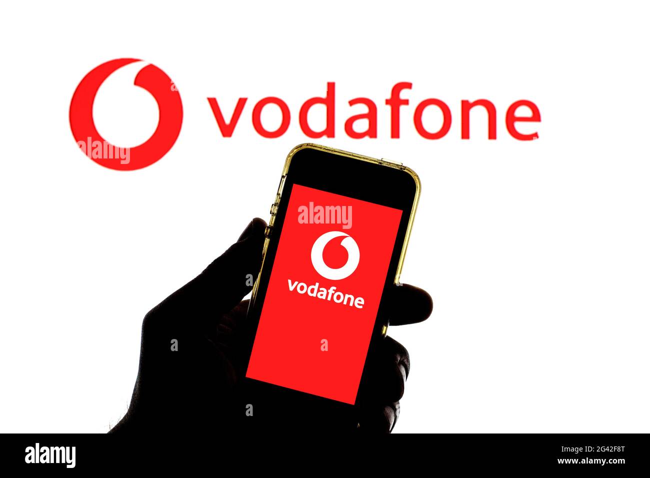 In this photo illustration a Vodafone logo seen displayed on a ...
