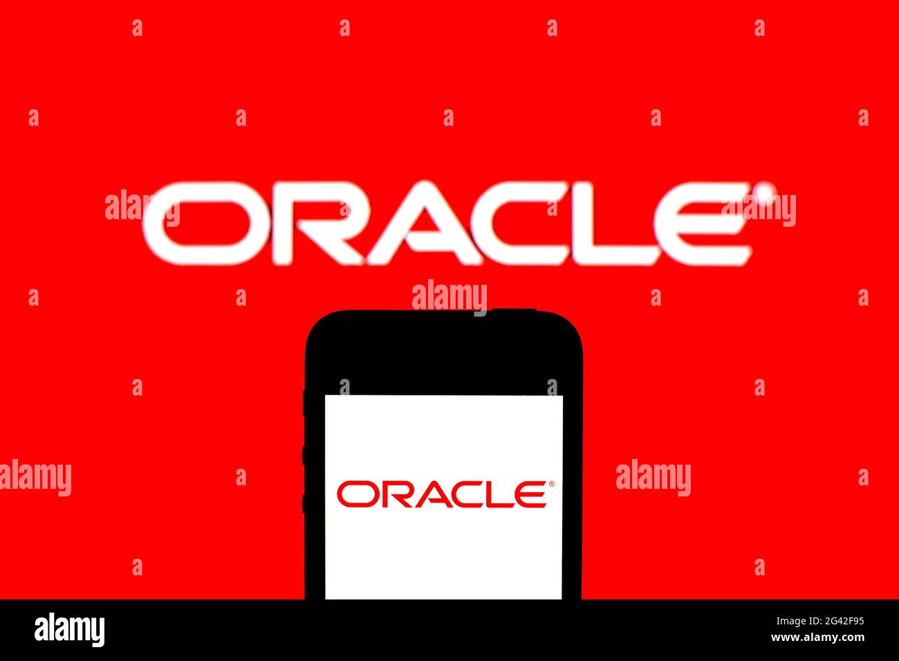 In this photo illustration an Oracle Corporation logo seen displayed on ...