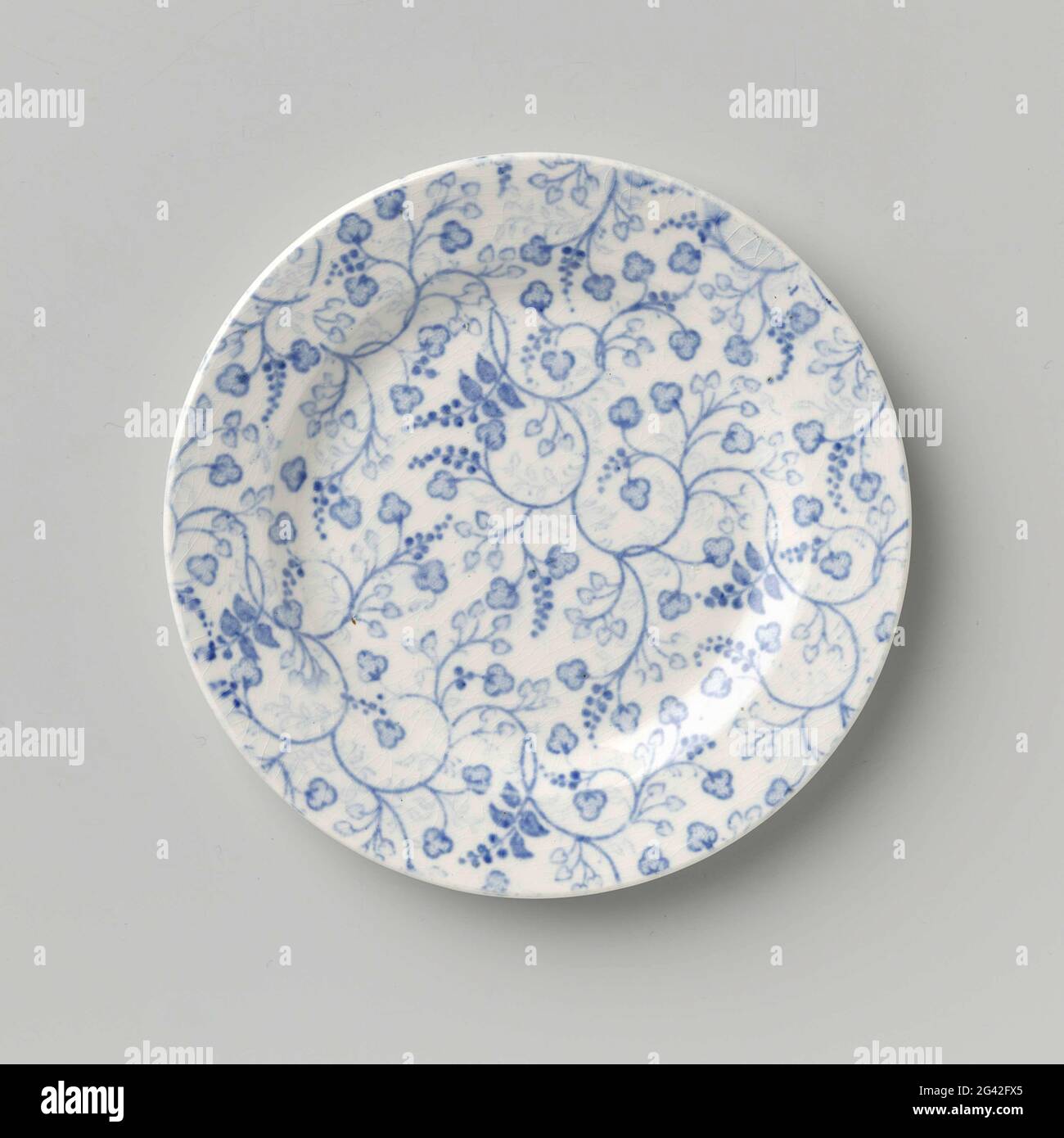 Plate. Pottery plate, with blue continuous floral decor, belonging to a ...