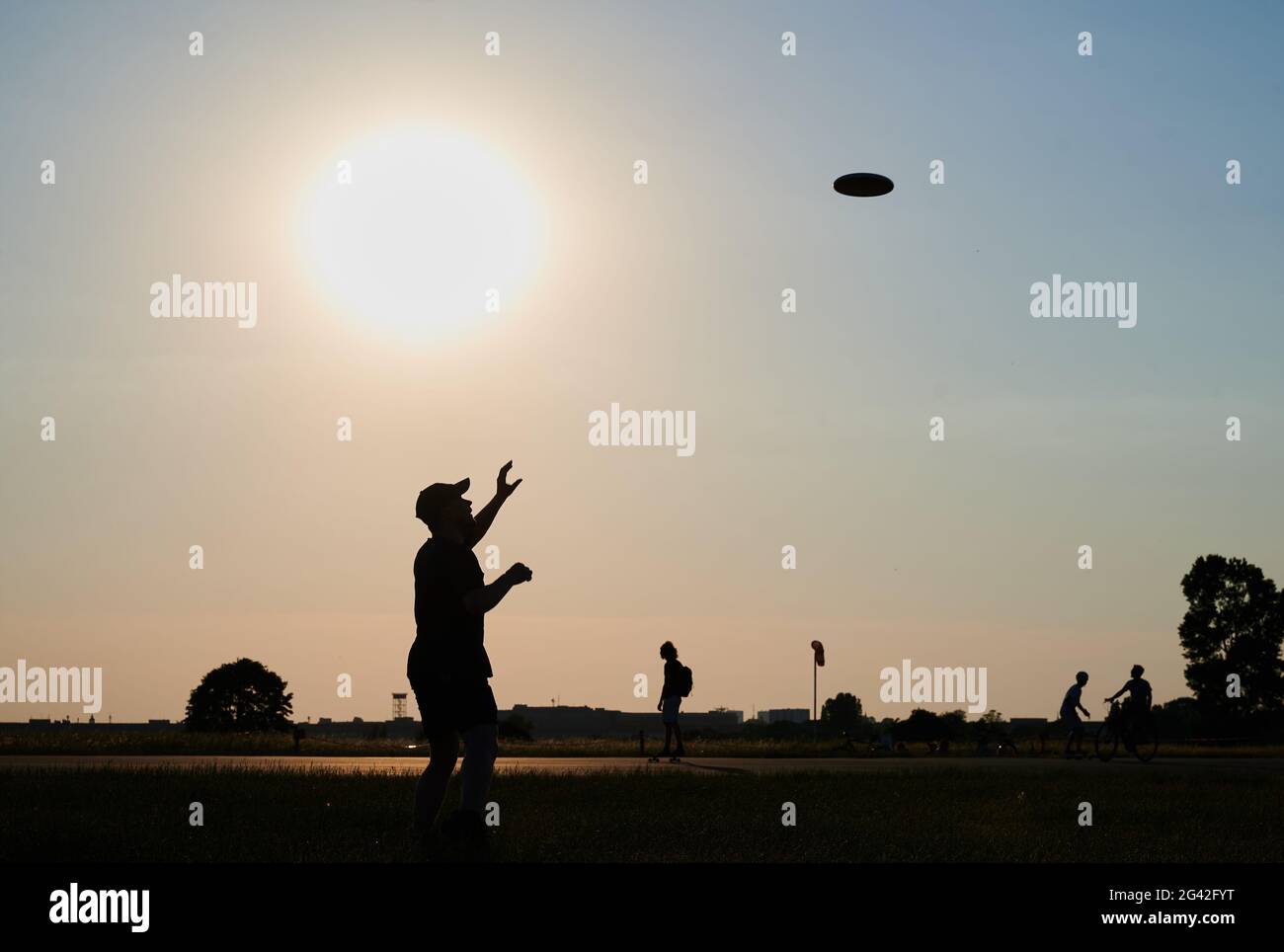 Berlin, Germany. 18th June, 2021. Two men are playing frisbee in the ...