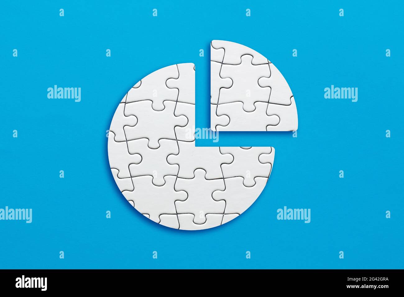 Pie chart shape made out of puzzle pieces on blue background. Economic ...