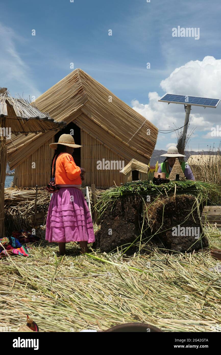 Locals showing how to make a reed island in Lake Titicaca Peru Stock ...