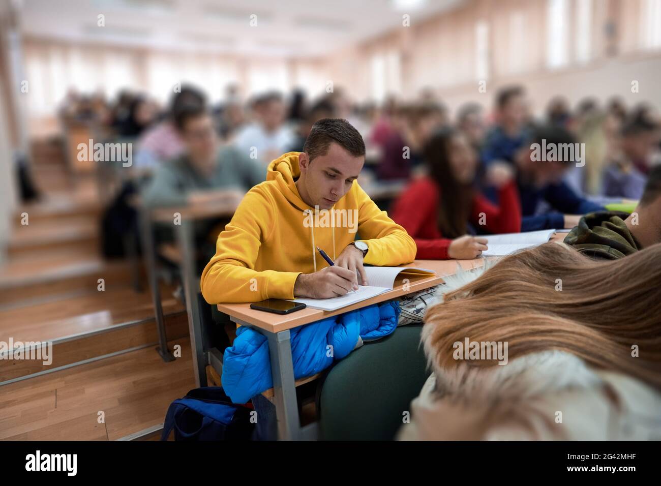 Student taking notes while studying in high school Stock Photo - Alamy