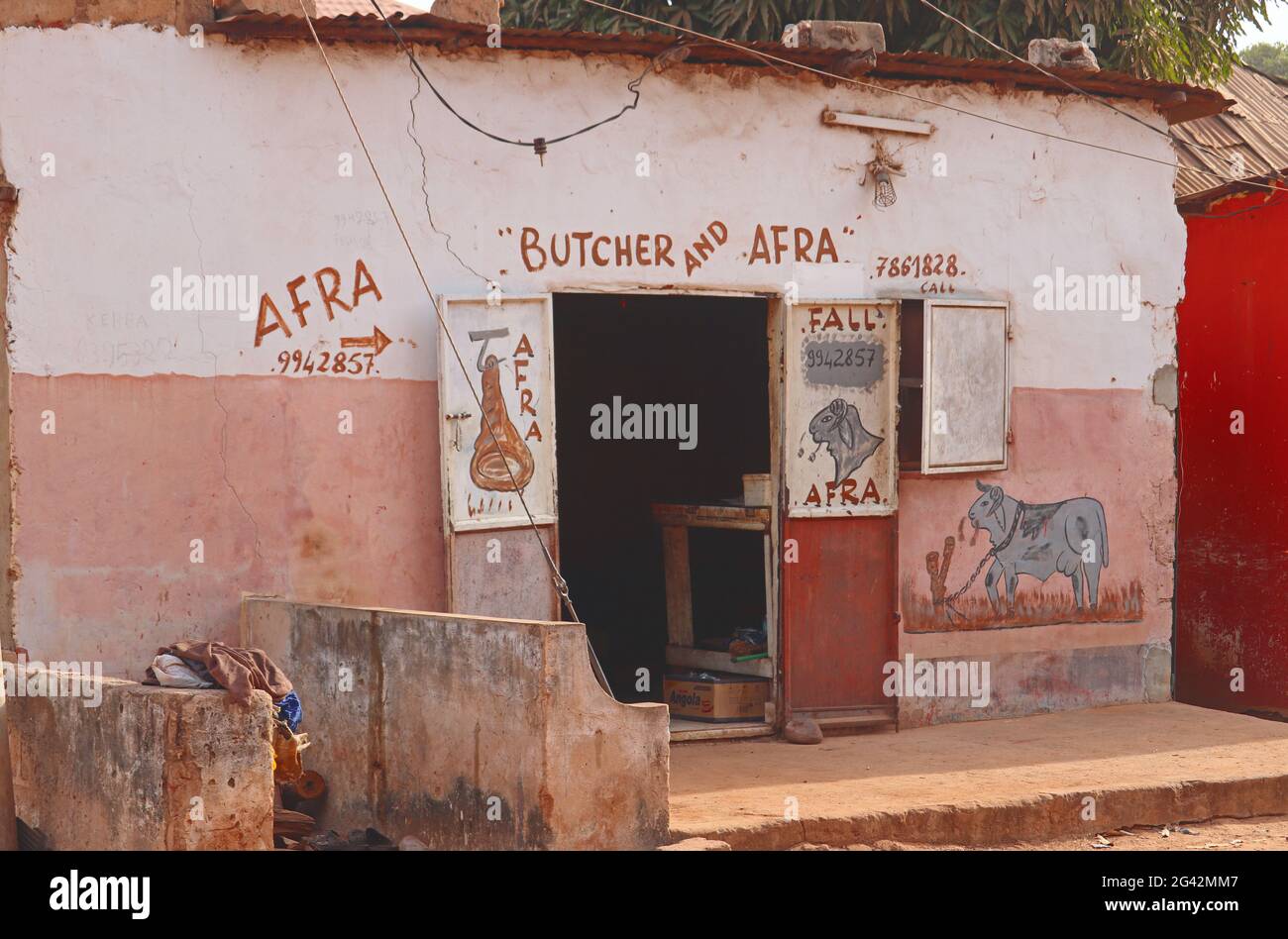 Gambia; Capital Region Banjul; Butcher shop with a painted facade in ...