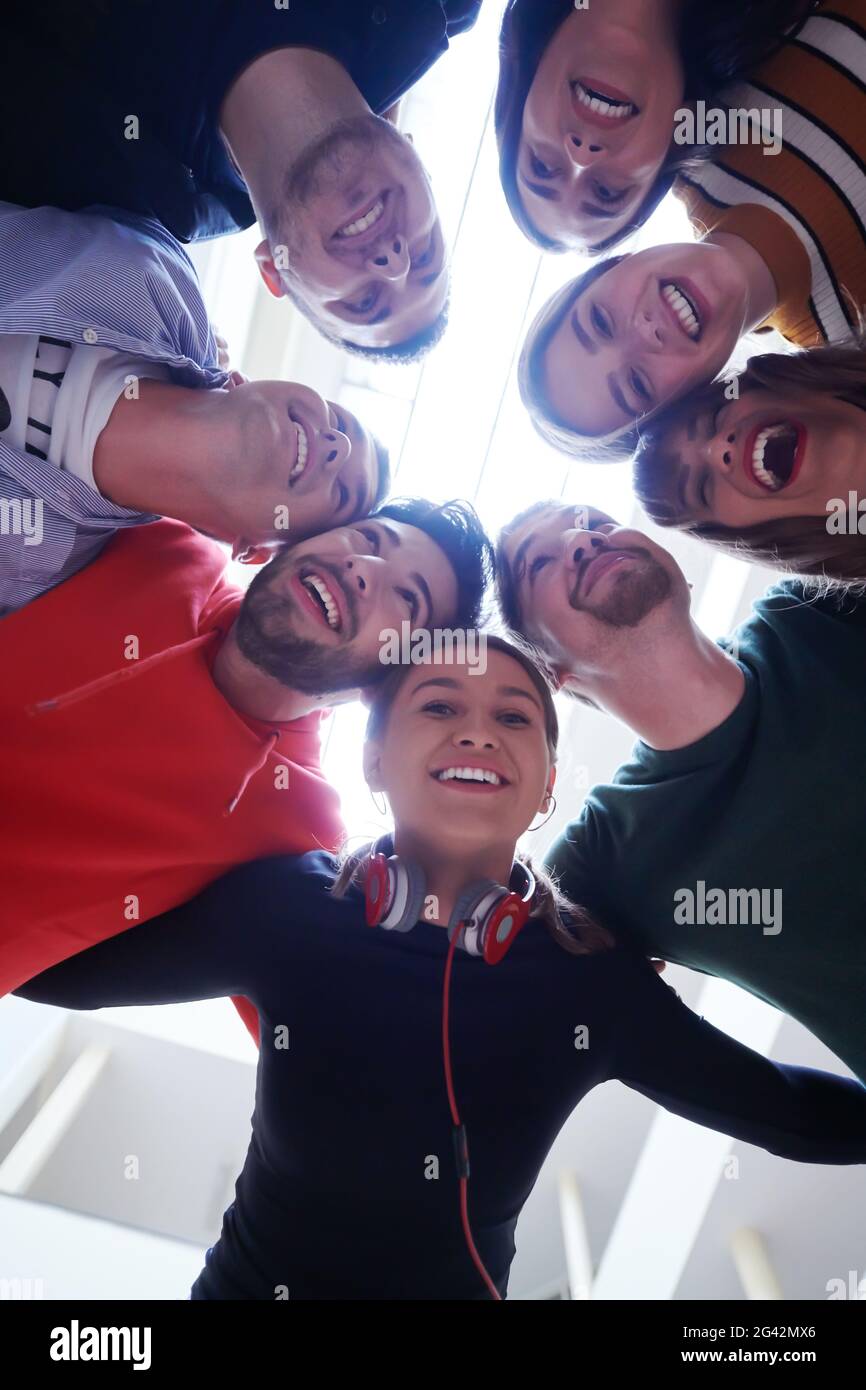 Group of happy young people showing their unity Stock Photo - Alamy