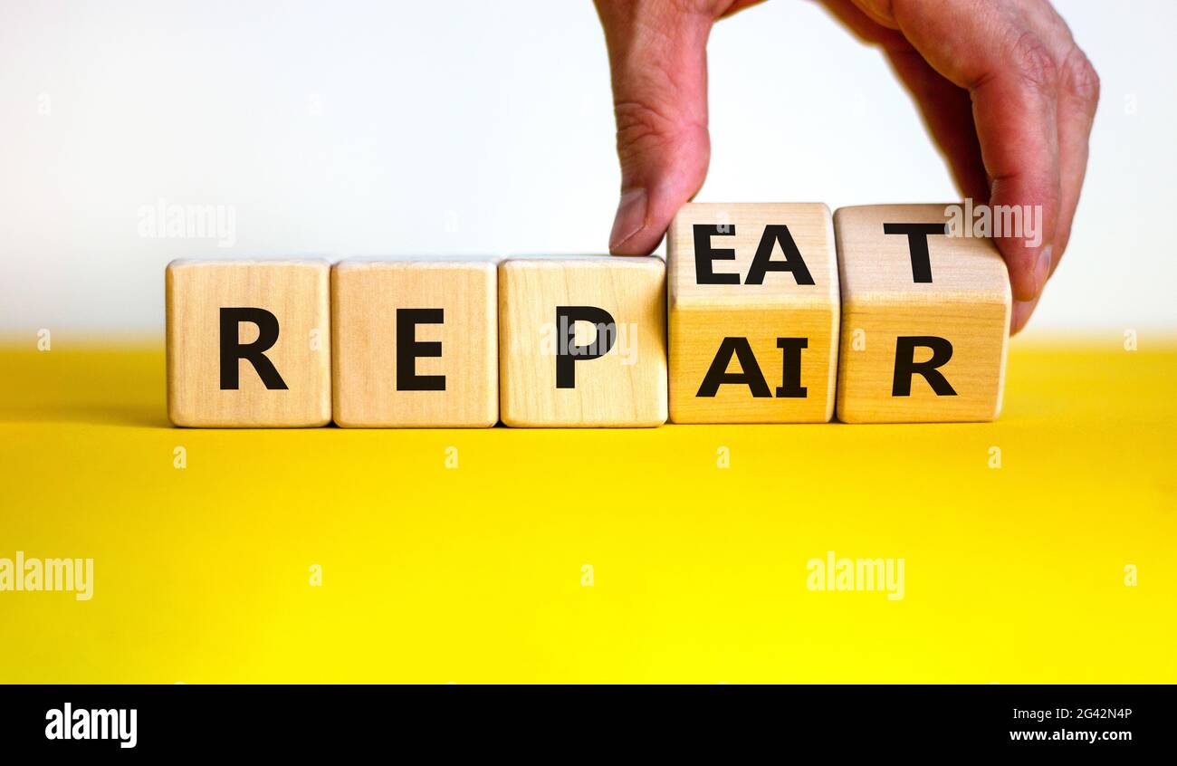 Repeat and repair symbol. Businessman turns wooden cubes and changes ...