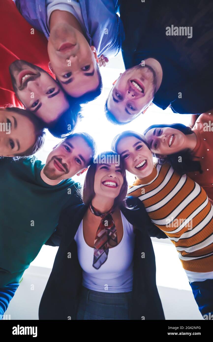 Group of happy young people showing their unity Stock Photo - Alamy