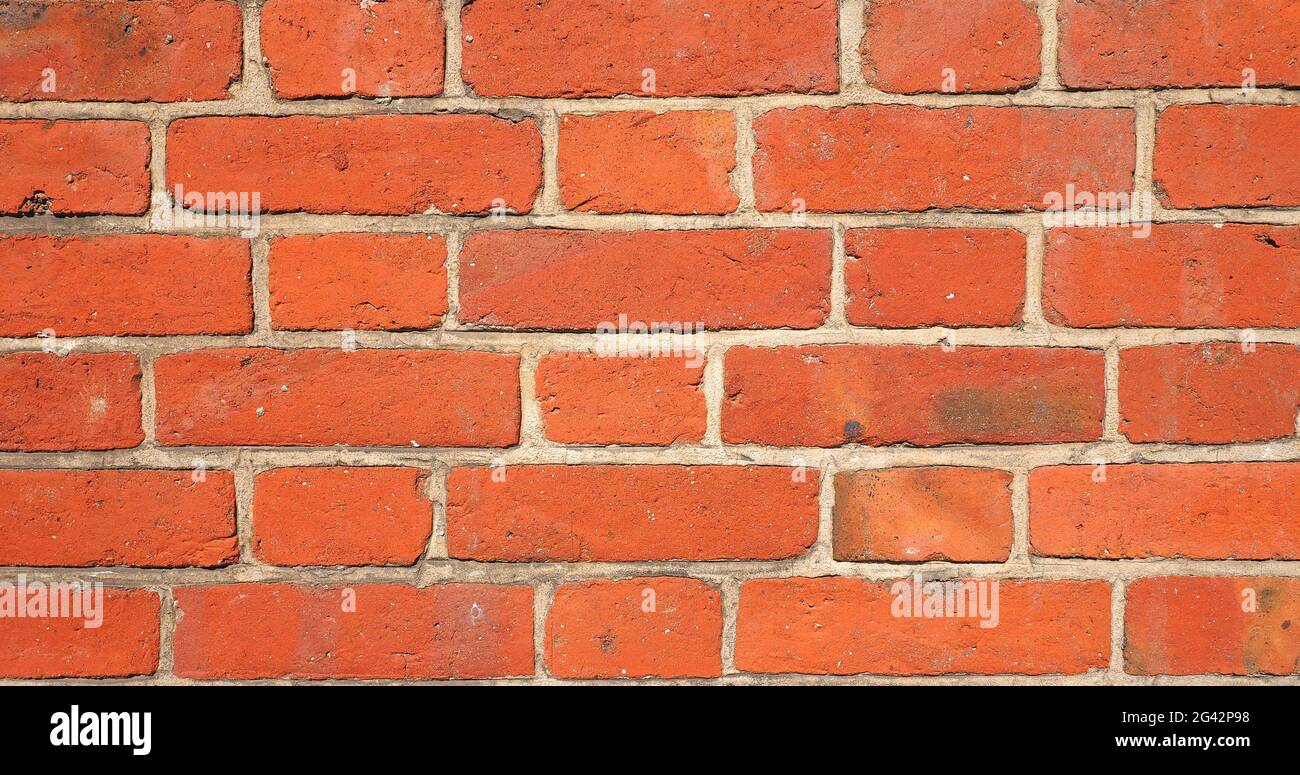 wide 4K red brick wall useful as a background Stock Photo - Alamy