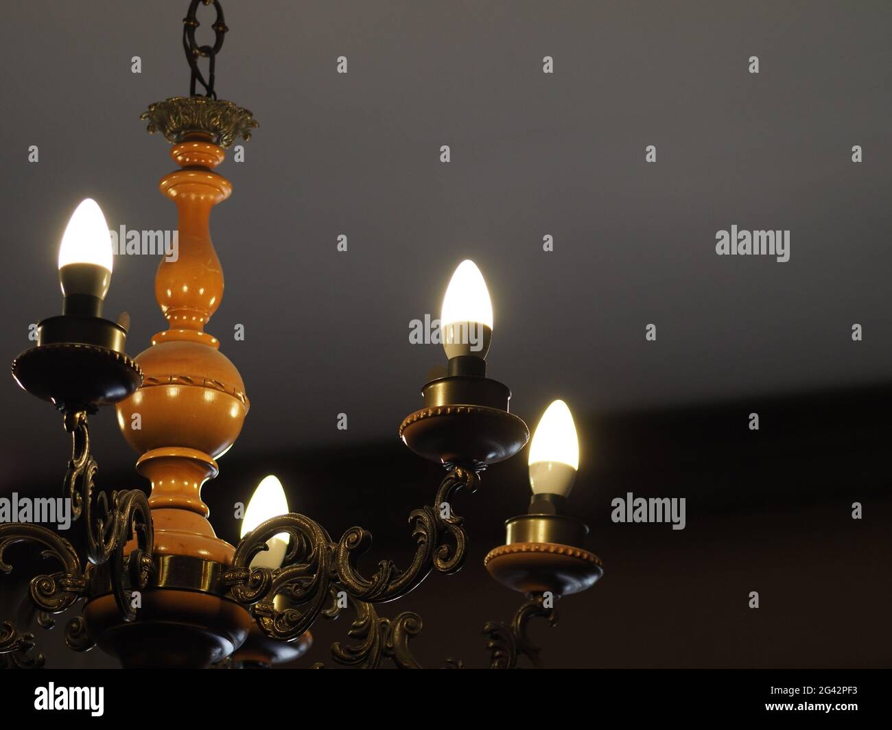 Ancient chandelier retrofitted with modern LED lamps Stock Photo - Alamy