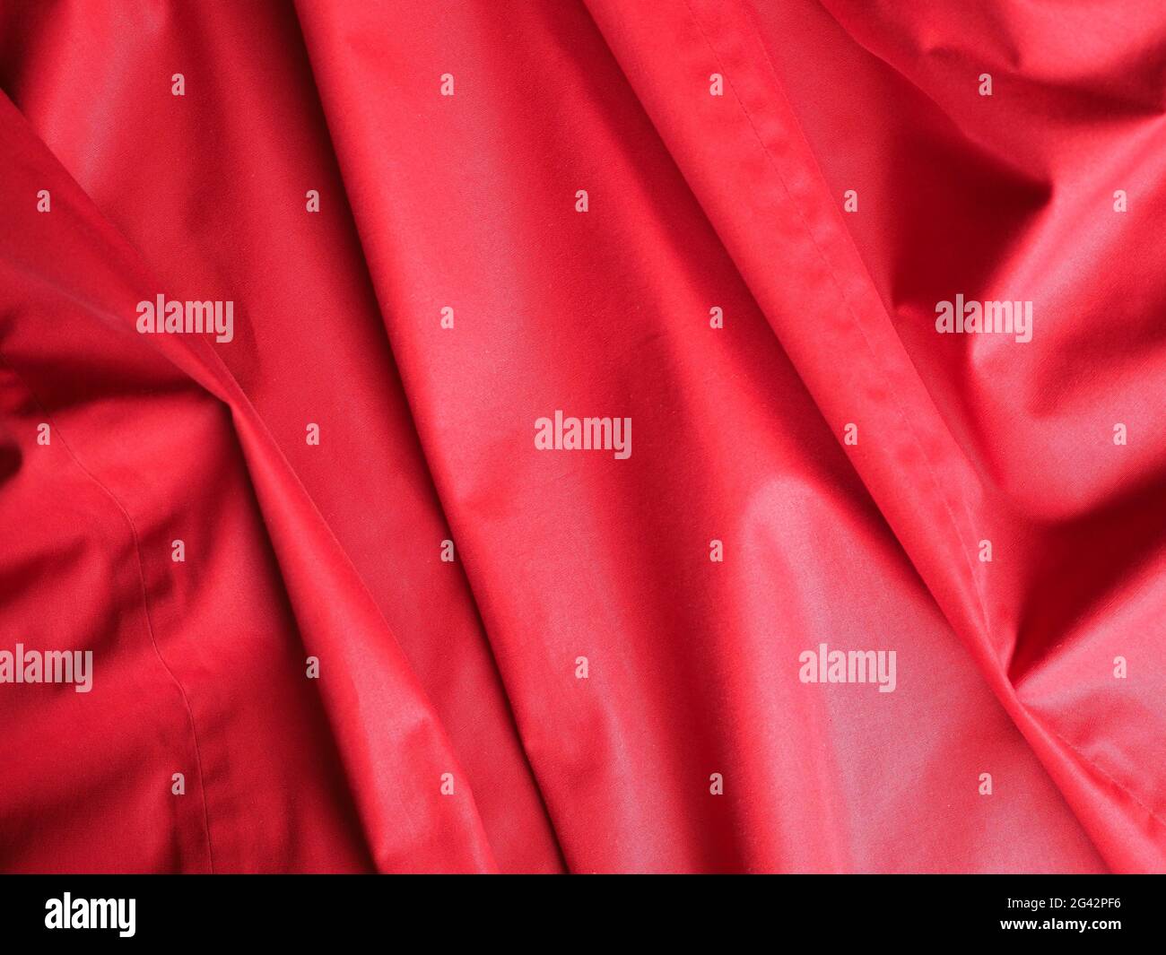 rippled red polyester fabric texture useful as a background Stock Photo ...