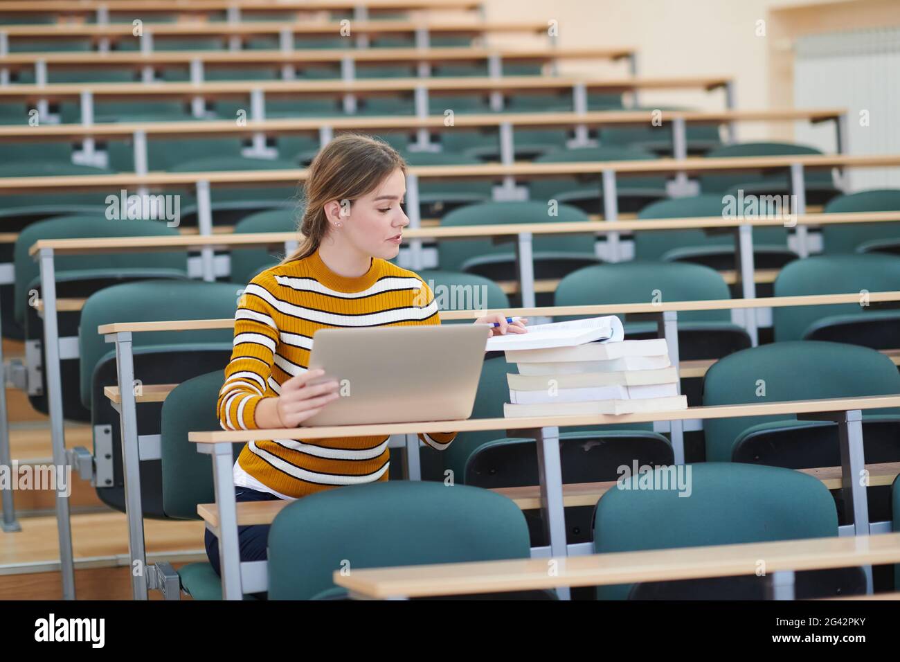 Satisfied student taking notes smiling hi-res stock photography and ...