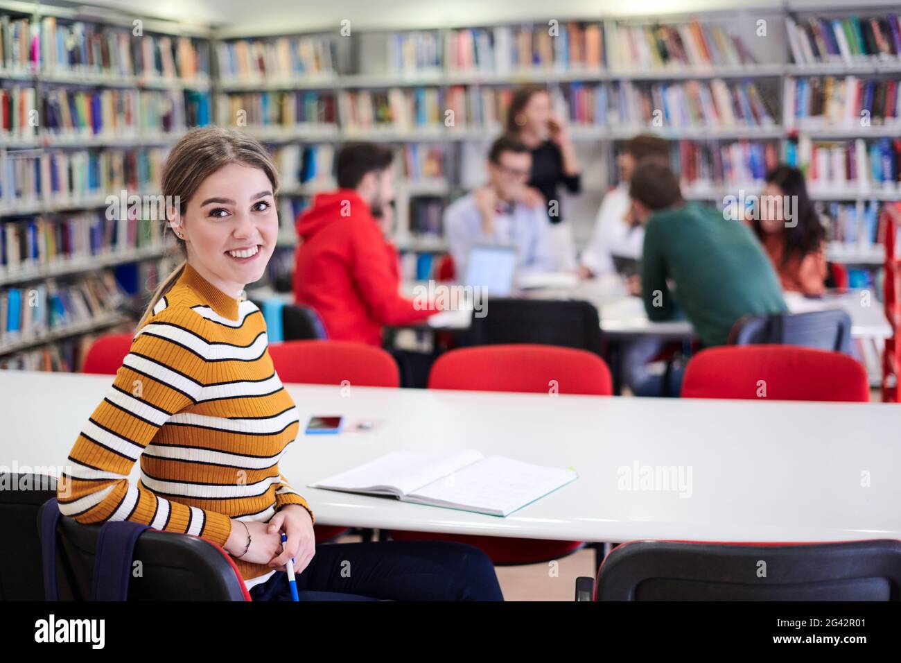 Student taking notes for school class Stock Photo - Alamy