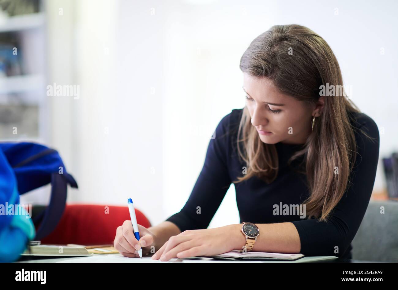 Student taking notes for school class Stock Photo - Alamy