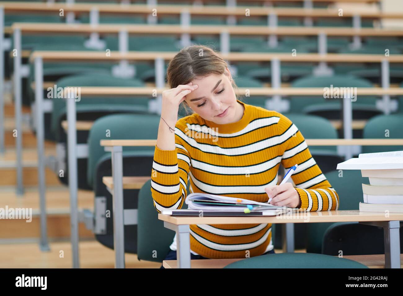 Student taking notes for school class Stock Photo - Alamy