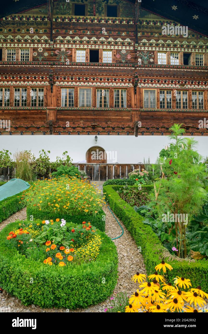 Old farmhouse with carvings, painting and cottage garden, Knuttihaus ...