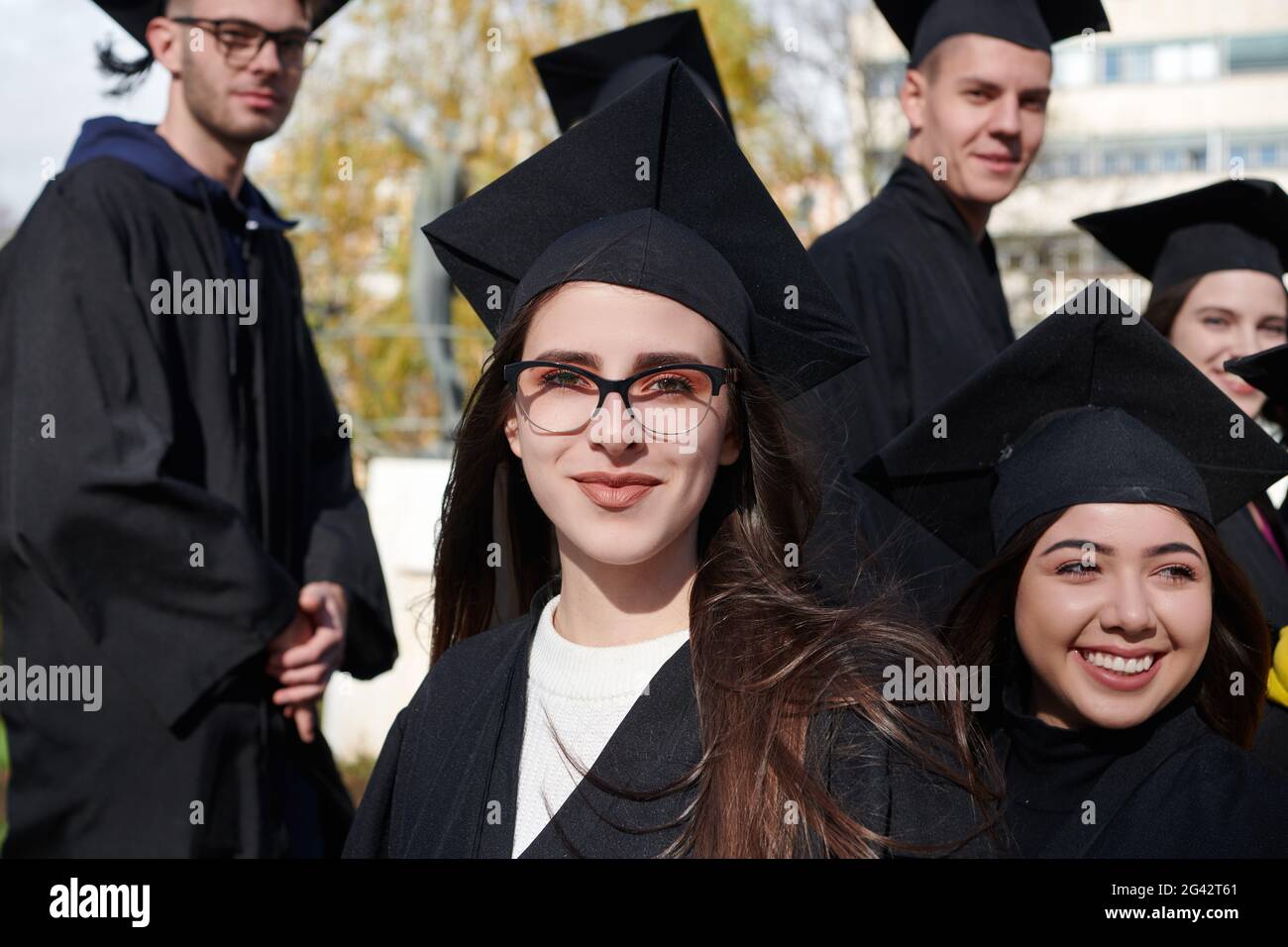 Joyful graduates celebrating success hi-res stock photography and ...