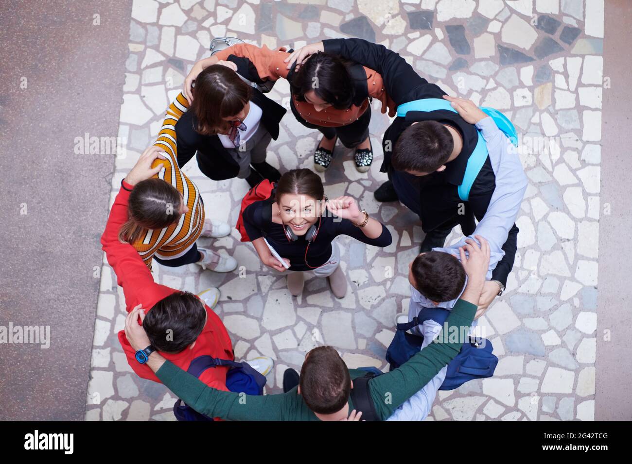 Group of happy young people showing their unity Stock Photo - Alamy