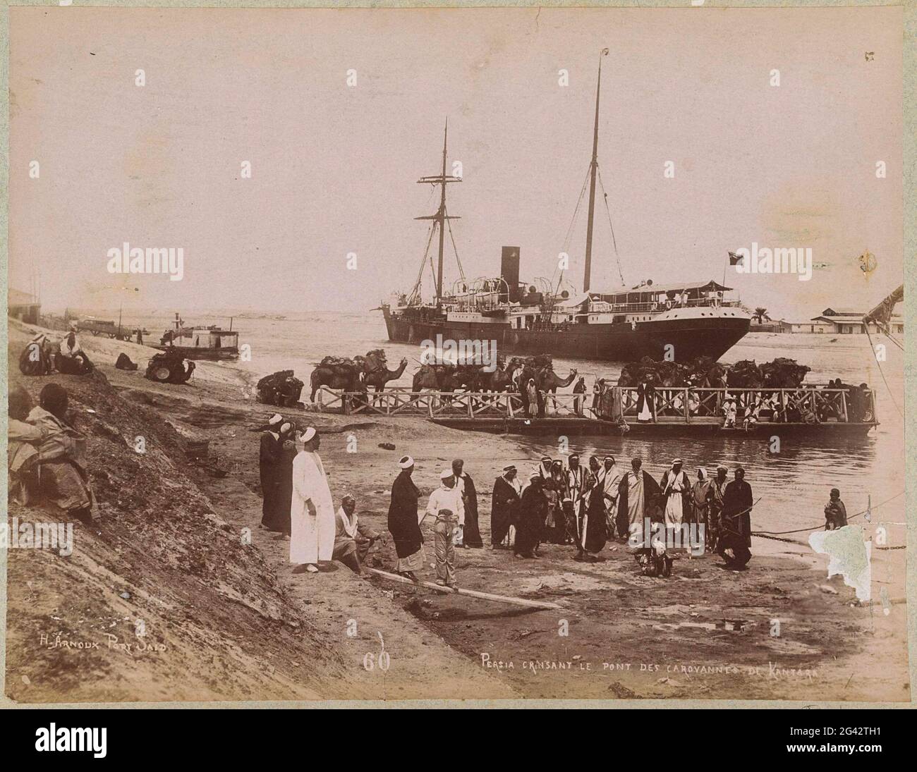 View of a mooring place at Kantara to the Suez Canal with a ship, men ...