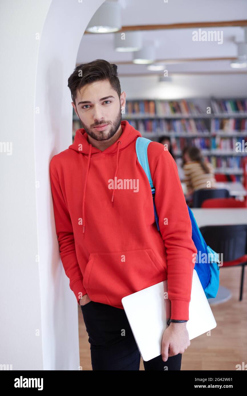 The student uses a laptop and a school library Stock Photo - Alamy